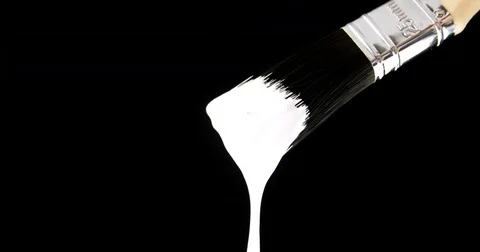 Paint falling from brush against black b... | Stock Video | Pond5
