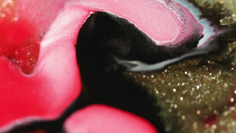 Paint spill ink mix red black golden flu... | Stock Video | Pond5