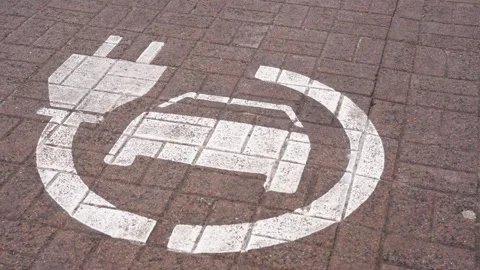 Painted EV Charging Symbol on Pavement M... | Stock Video | Pond5