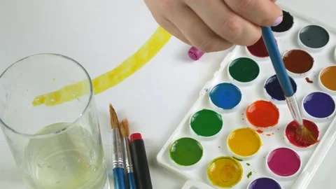 Painting on white paper.The color palett... | Stock Video | Pond5