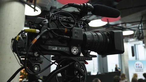 A pair of camera recording a group of pe... | Stock Video | Pond5