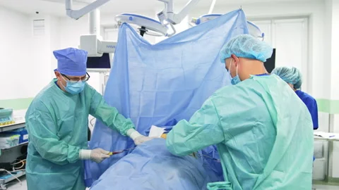 Pair of doctors collaborating at operati... | Stock Video | Pond5