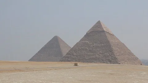 Pair of Egyptian Pyramids Standing Side ... | Stock Video | Pond5