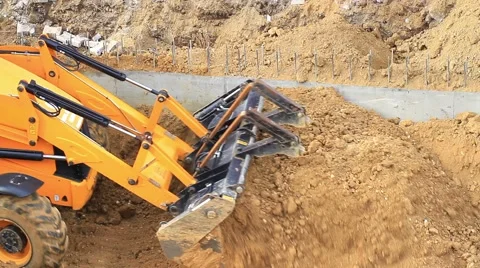 Pair of rubber tired backhoe excavator l... | Stock Video | Pond5