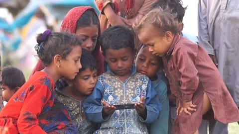 Pakistani Poor Children See A Mobile Pho... | Stock Video | Pond5