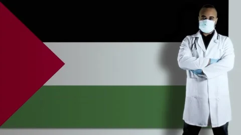Palestine doctor with flag | Stock Video | Pond5