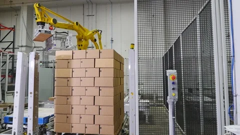 Pallet shrink wrapping robot arm in ware... | Stock Video | Pond5