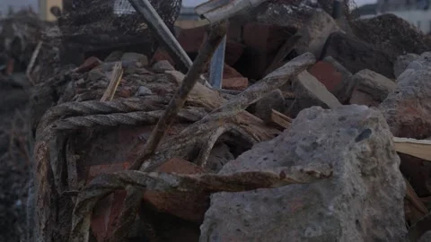Pan across brick rubble with rebar from ... | Stock Video | Pond5
