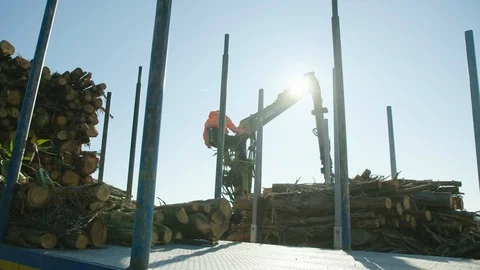 Pan across trailer as crane operator mov... | Stock Video | Pond5