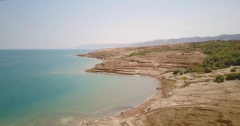 pan down aerial over shrinking dead sea ... | Stock Video | Pond5