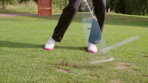 Pan down shot of Golfer swinging and hit... | Stock Video | Pond5