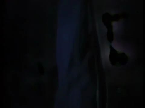 Pan down tied up man hanging upside down | Stock Video | Pond5