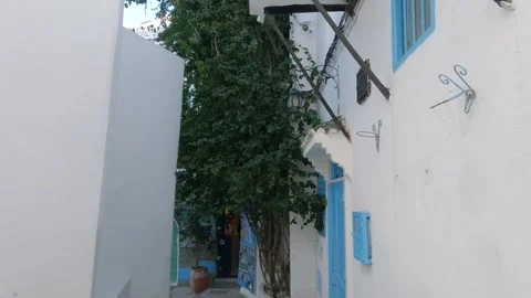 Pan Down View Along Narrow Quaint Street... | Stock Video | Pond5