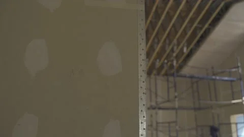 Pan focus from wall to scaffolding insid... | Stock Video | Pond5