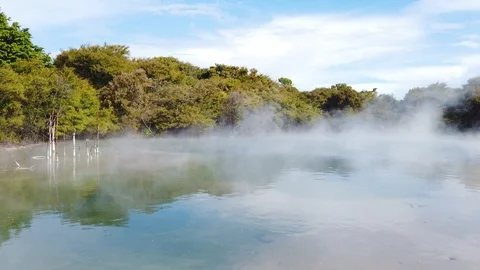 Pan over steaming thermal lake in New Ze... | Stock Video | Pond5