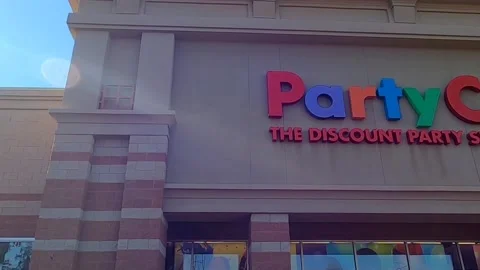Pan in of Party City sign with lens flar... | Stock Video | Pond5