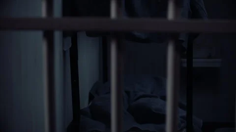 Pan-right shot of guard walking by priso... | Stock Video | Pond5