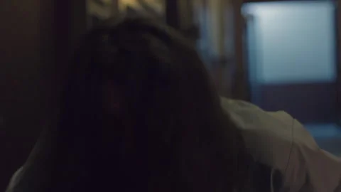 Pan right shot of woman collapse in an a... | Stock Video | Pond5