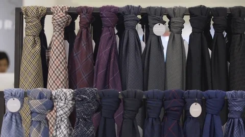 Pan of a selection of fabric for suits | Stock Video | Pond5