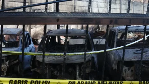 Pan Shot of cars caught on fire as a fue... | Stock Video | Pond5