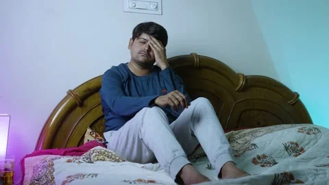 pan shot of young man thinking deep whil... | Stock Video | Pond5