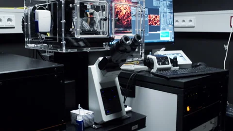 Pan up to a very modern digital microsco... | Stock Video | Pond5
