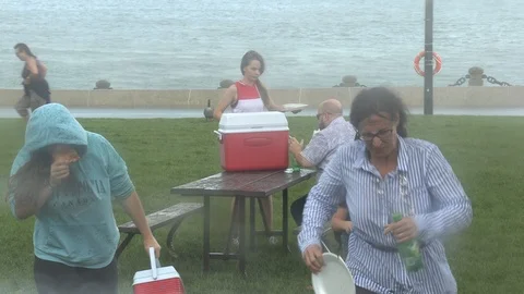 Panic at picnic table as severe storm hi... | Stock Video | Pond5