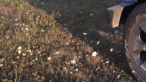 Panning close-up shot of the tire and wh... | Stock Video | Pond5