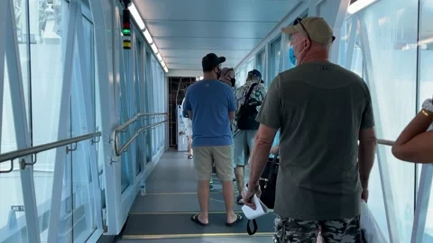 Panning left on guests waiting in line o... | Stock Video | Pond5