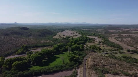 Panoramic of a road with two vehicles in... | Stock Video | Pond5