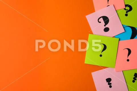 Paper cards with question marks on orange background, flat lay. Space ...