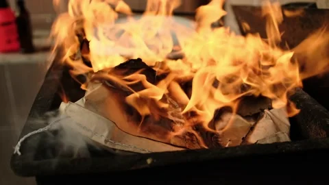 Paper drenched in lighter fluid burns on... | Stock Video | Pond5