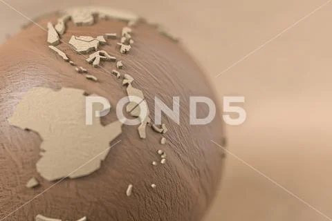 Paper earth model on cardboard background ~ Clip Art #213884707