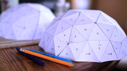 Paper Geodesic Domes on Desk | Stock Video | Pond5