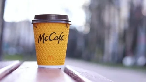 A paper latte cup with the McDonald's fa... | Stock Video | Pond5