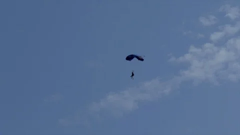 Parachutist flying canopy after skydivin... | Stock Video | Pond5