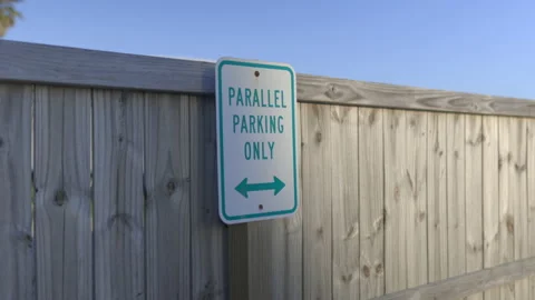 Parallel parking only sign on wooden fen... | Stock Video | Pond5