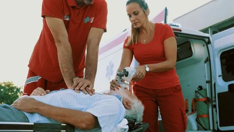 Paramedics saving life of a old man who ... | Stock Video | Pond5