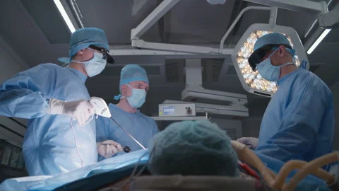 Paramedics use laparoscopic tools during... | Stock Video | Pond5