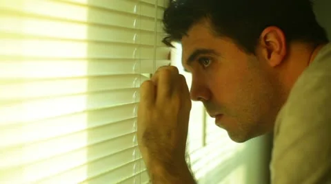 paranoid man peep peeping blinds | Stock Video | Pond5