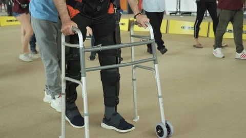 Paraplegic Boy in Upright Posture Walkin... | Stock Video | Pond5