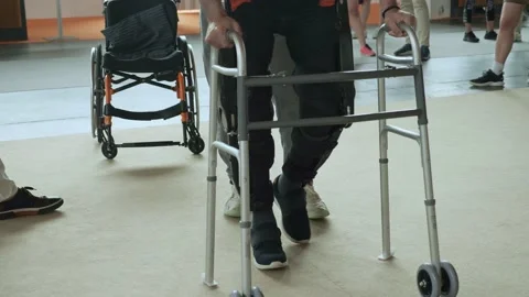 Paraplegic Boy in Upright Posture Walkin... | Stock Video | Pond5