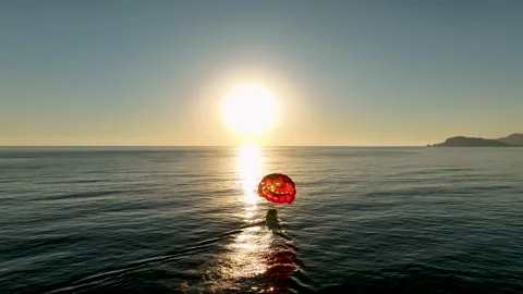Parasailing over the sea at the most bea... | Stock Video | Pond5