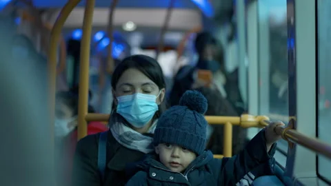 Parent and child riding bus during pande... | Stock Video | Pond5