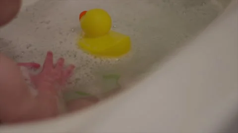 Parent bathing baby close up bath time p... | Stock Video | Pond5