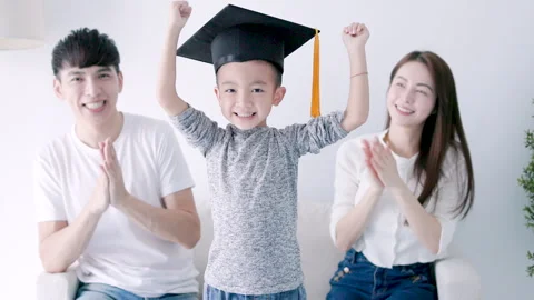 Parent congratulates child on graduatin... | Stock Video | Pond5