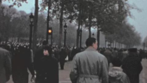 Paris - 1957: crowd walk with soldiers t... | Stock Video | Pond5