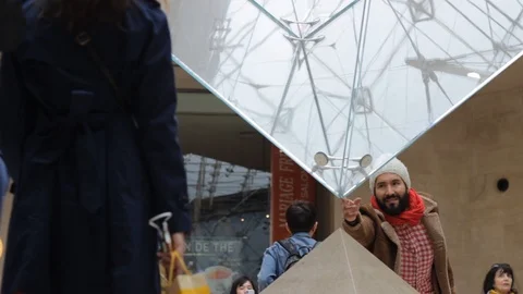 Paris, tourists touch reverse pyramid at... | Stock Video | Pond5
