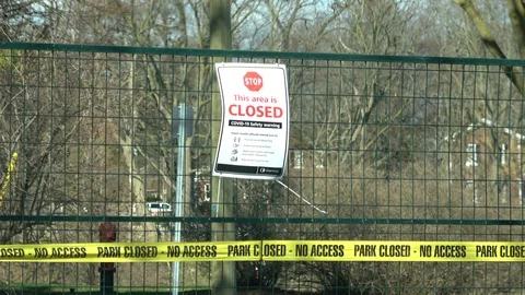 Park closed signage with yellow tape on ... | Stock Video | Pond5