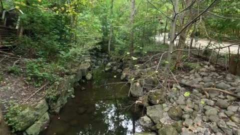 park scene stream under bridge people wa... | Stock Video | Pond5